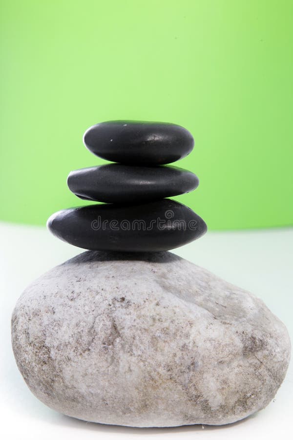 Three Black Stones Stacked on Top of Each Other Stock Image - Image of ...