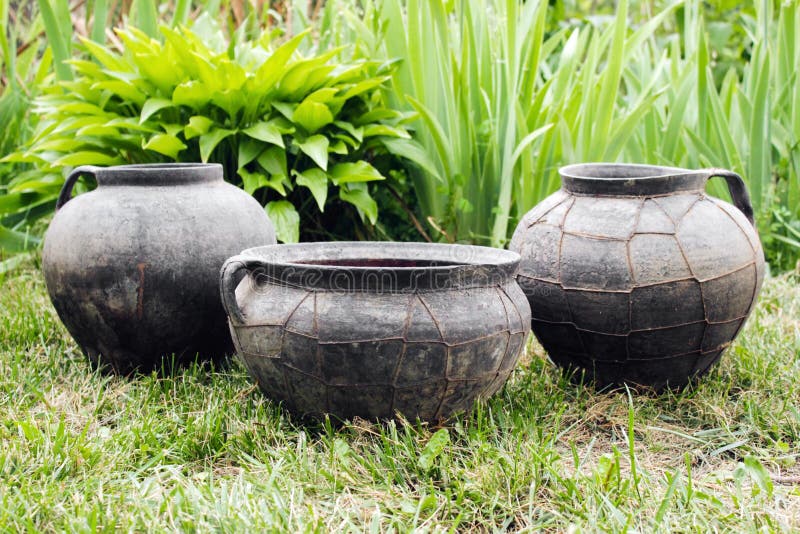 Three Black Vintage Handmade Clay Pots with Wire Stock Photo - Image of ...