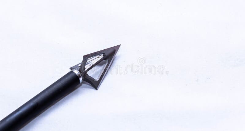 A Three Blade Broadhead on the End of a Carbon Arrow and Another with a ...