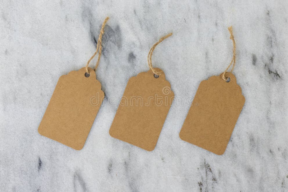 Three Blank Brown Gift Tags with Twine on Marble Background Stock Image ...