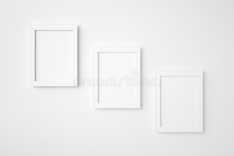 Three Blank or Empty Rectangle Picture Frames Hanging on White Wall ...