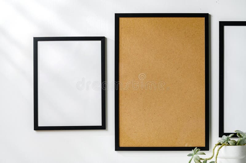 Three Blank Frames with Copy Space Hanging on White Wall Stock Image ...