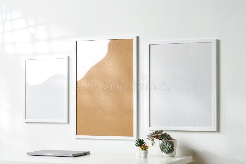 Three Blank Frames with Copy Space Hanging on White Wall Stock Photo ...