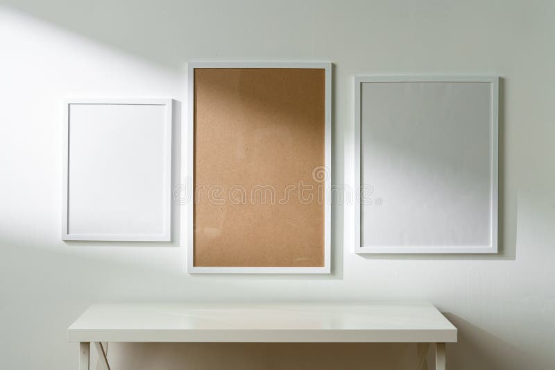 Three Blank Frames with Copy Space Hanging on White Wall Stock Photo ...