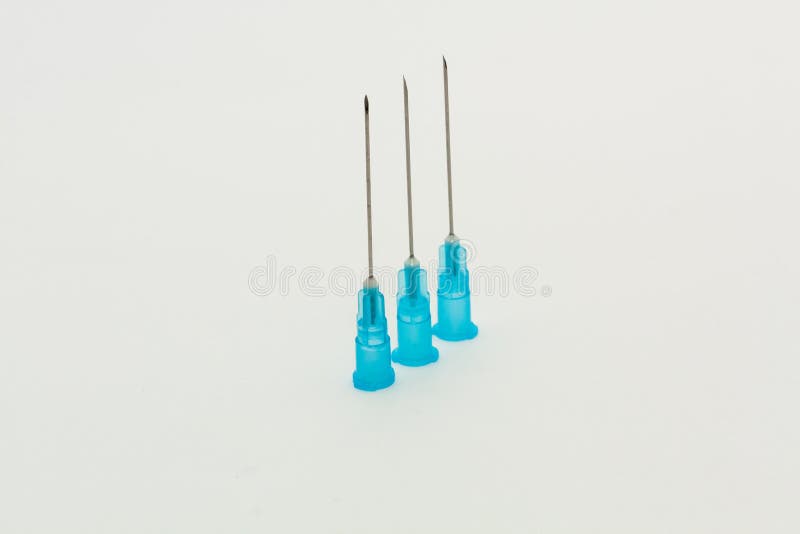 Three Blue Needles and One 1ml Disposable Plastic Syringe Stock Photo ...