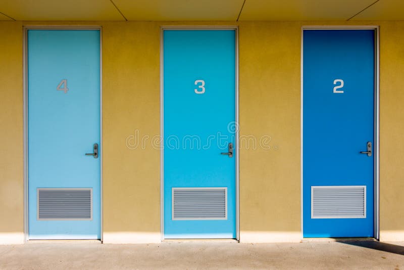 Three Blue Doors stock image. Image of vents, door, numbers - 57271127