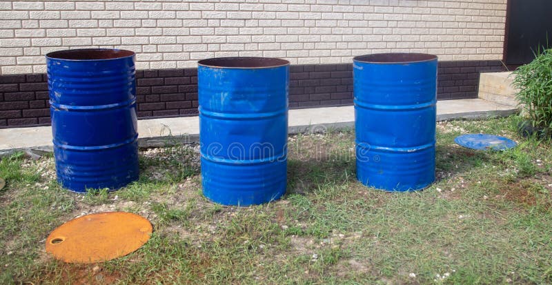 Three Blue Metal Barrels at a Construction Stock Image - Image of green ...