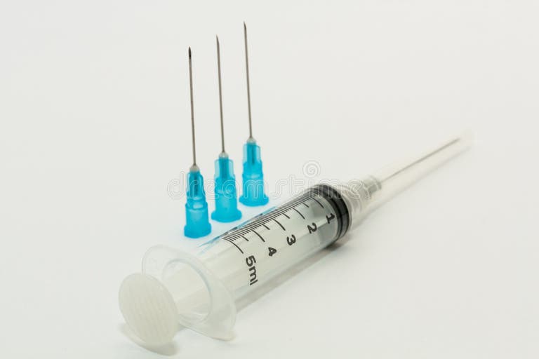 Three Blue Needles and One 5ml Disposable Plastic Syringe Stock Image ...