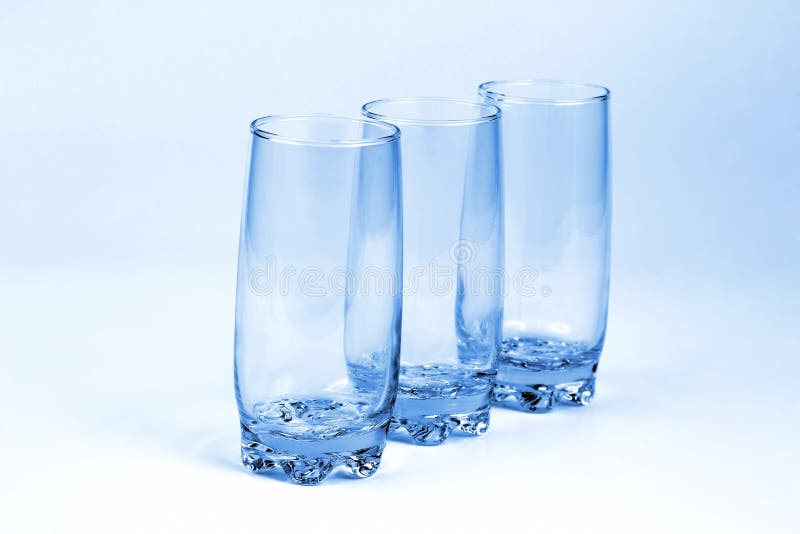 Three Blue Transparent Glass with a Light Blue Background Stock Image ...