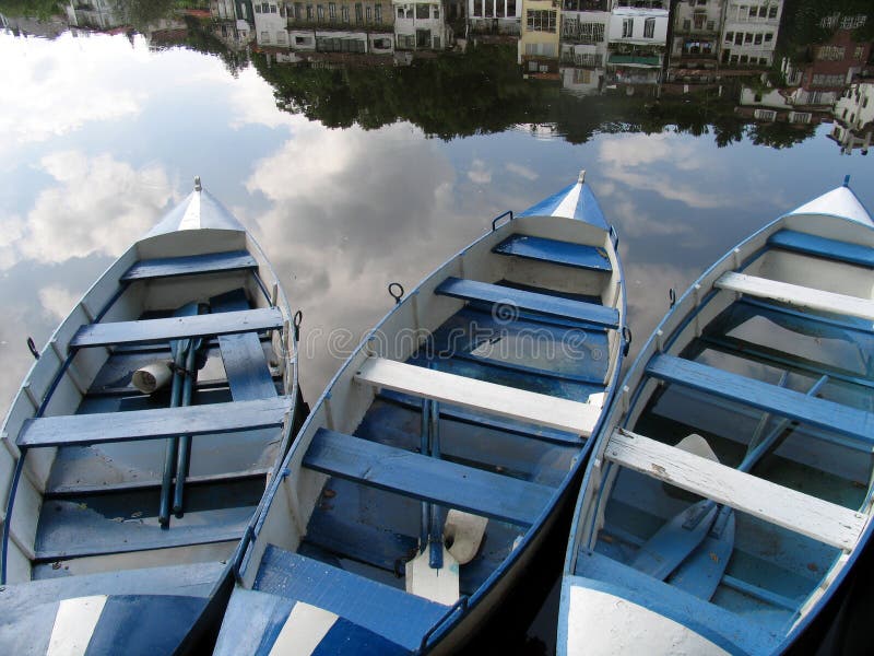 Three boats stock image. Image of river, swim, boats, reflection - 1041529