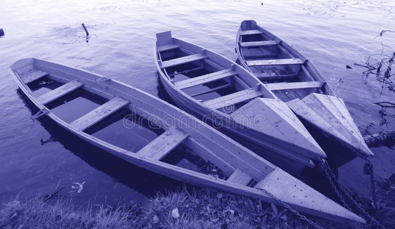 Three Boats on Coast stock photo. Image of chain, blue - 3646040