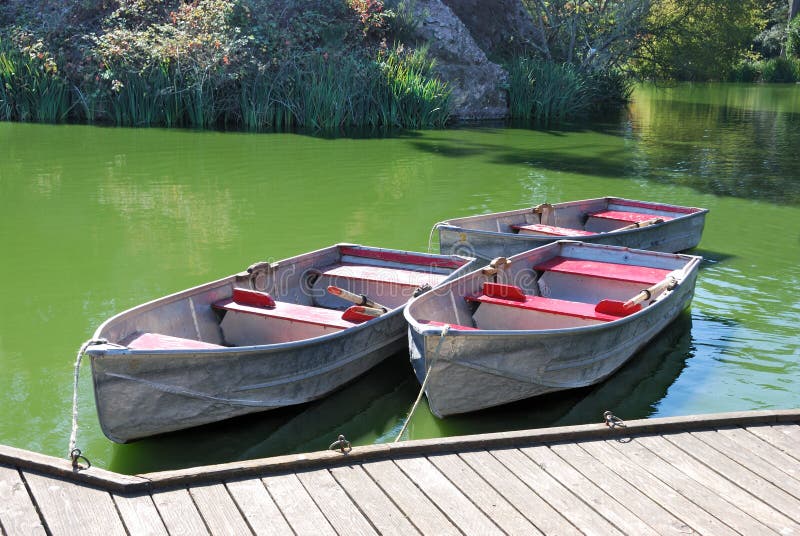 Three Boats on Lake stock image. Image of water, wood - 7077457