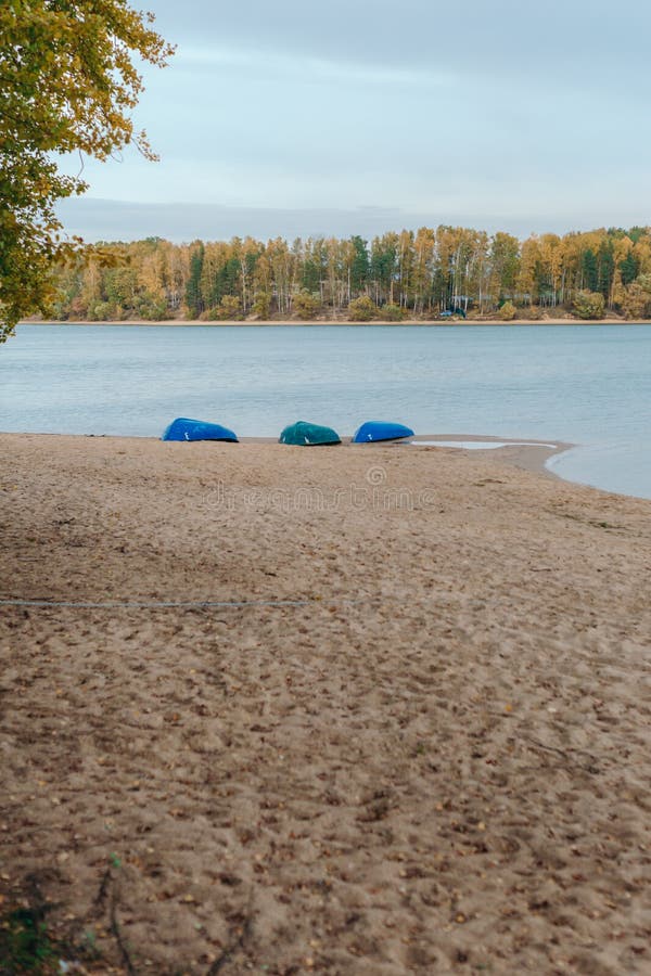 Three Boats on the Sandy River Bank. Forest in the Background. Stock ...