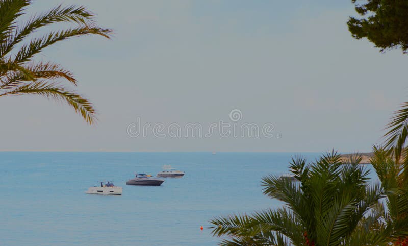 Three Boats in the Sea Near the Shore Stock Photo - Image of beach ...