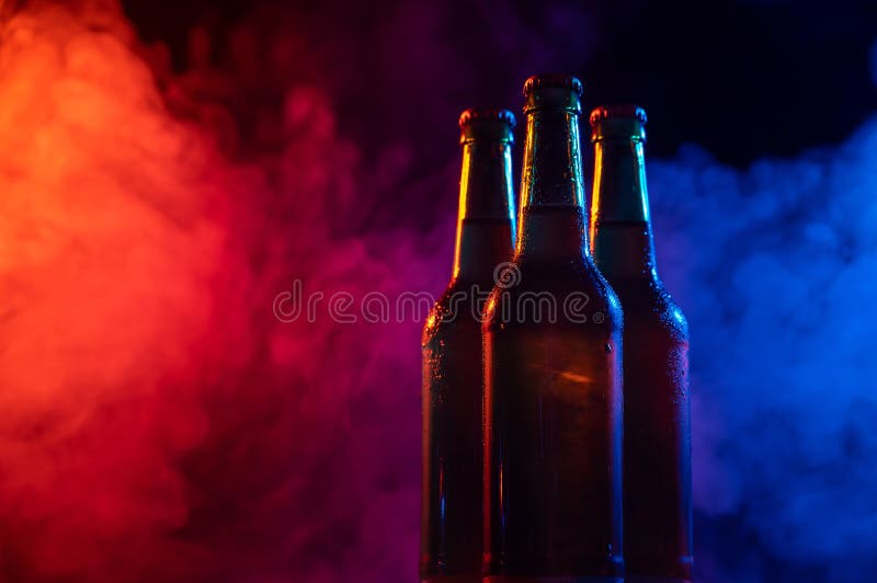 Three Bottles of Beer in a Blue-pink Mist. Stock Image - Image of pink ...