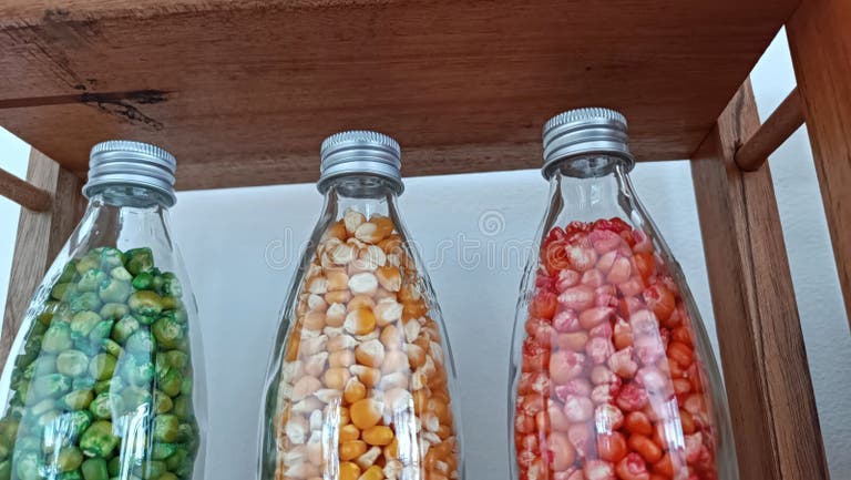 Three Bottles of Corn are on a Shelf Stock Photo - Image of unhealthy ...