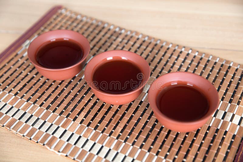 Three Bowls of Black Tea in a Row Stock Image - Image of kung, purple ...