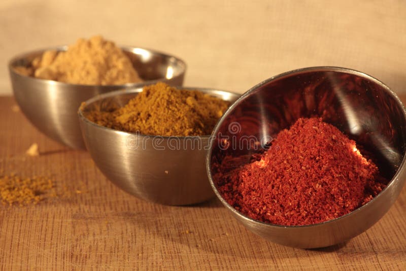 Three bowls of spices stock photo. Image of curry, metall - 35064618