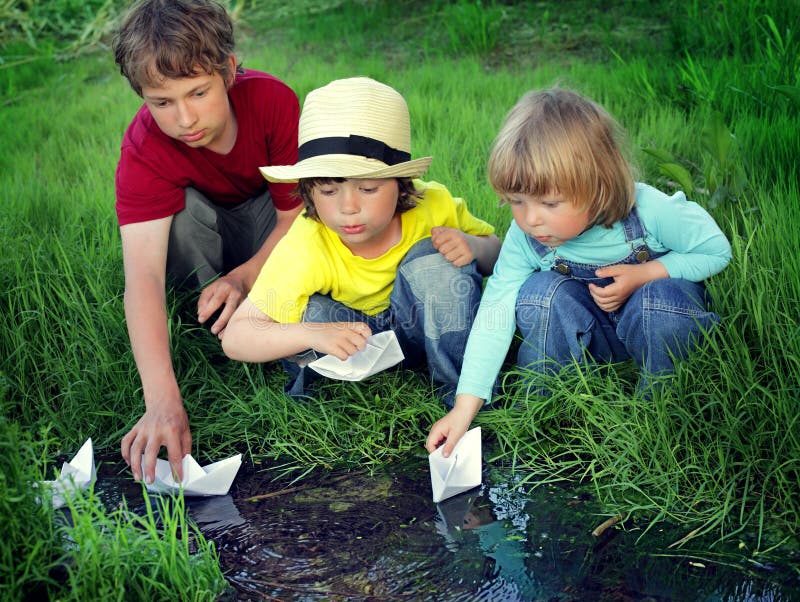 Three boy play in stream stock photo. Image of nature - 50928924