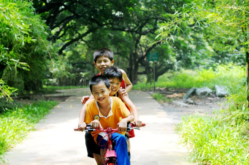 Three Boys Riding Bicycle Stock Photos - Free & Royalty-Free Stock ...