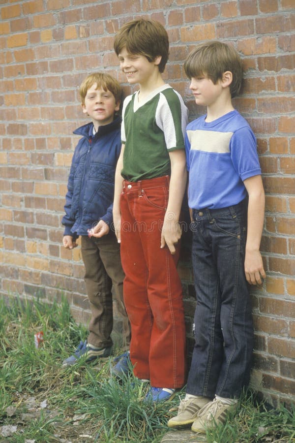 Three Boys Standing in Front of a Brick Wall in Harrison, ID Editorial ...