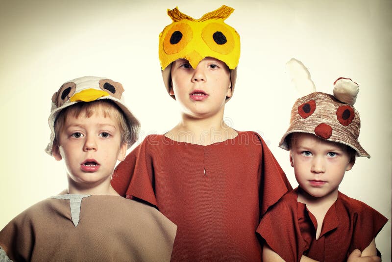 Three Boys Standing by the White Background Ready for Carnival Stock ...