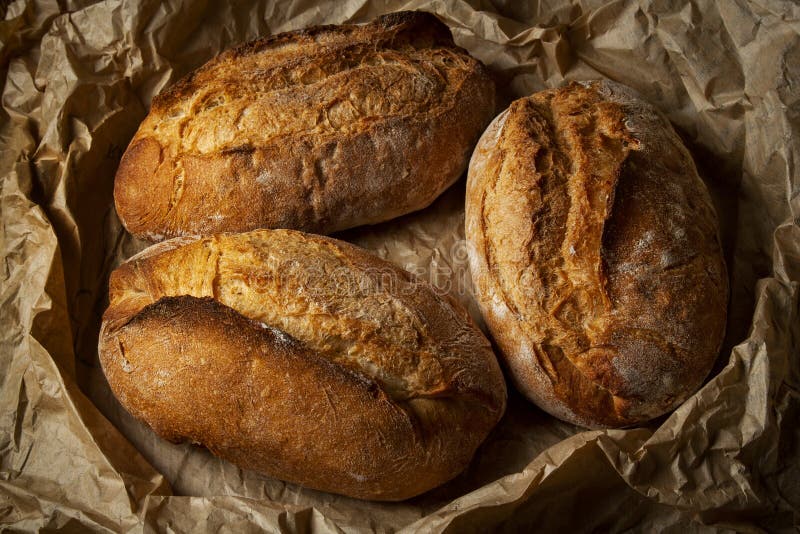 Three breads on the paper stock image. Image of dish - 223125775