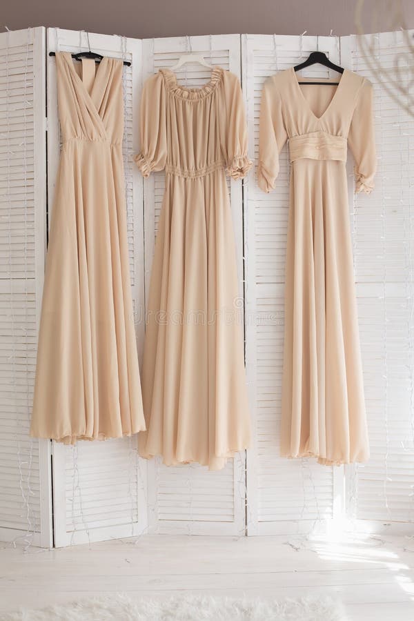 Three bridesmaids dresses stock image. Image of beige - 62054677