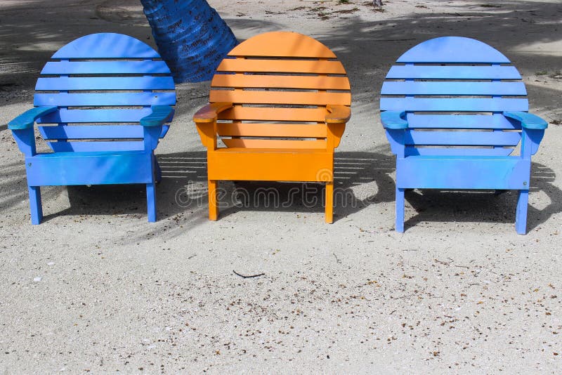 Three Bright Colored Beach Chairs on the Sand with Bottom Copy S Stock ...