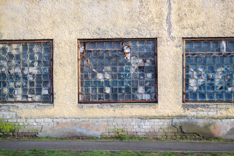 Three Broken Windows and a Grill on Them. Large Old Windows of an ...