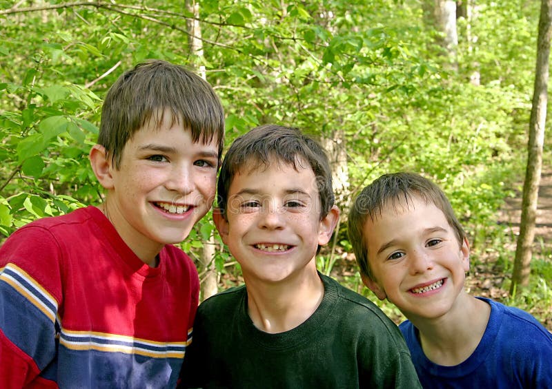 Three Boys Pledge Allegiance To the American Flag Stock Photo - Image ...