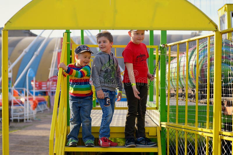 Three Brothers in an Amusement Park Stock Photo - Image of three ...