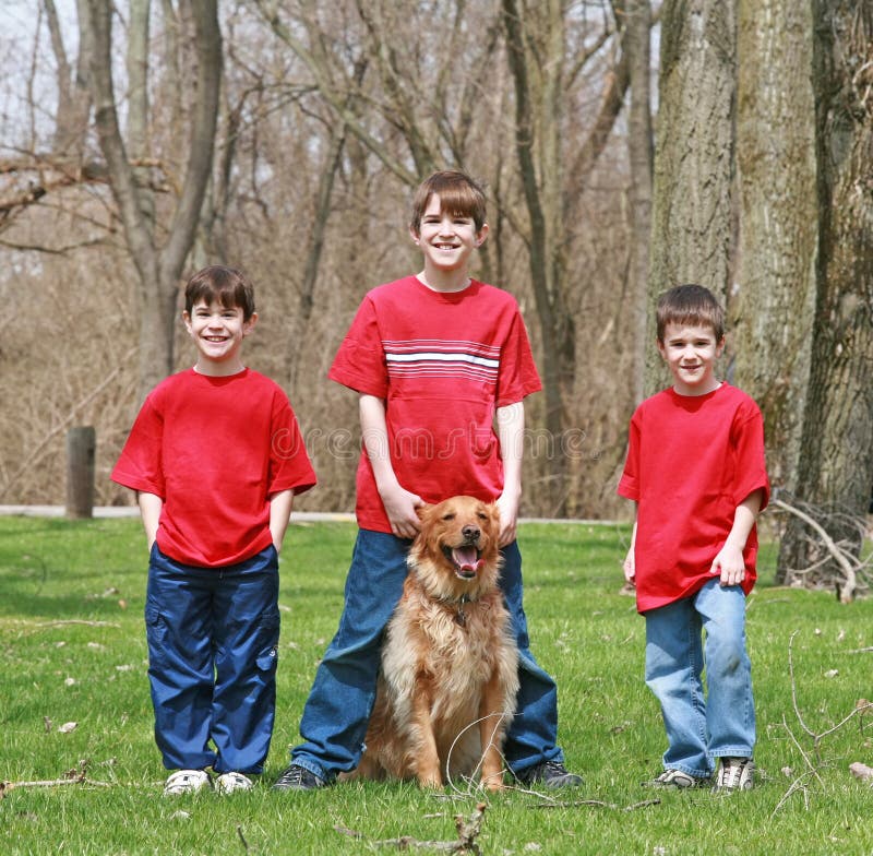 Three Brothers and the Dog stock photo. Image of domestic - 5021142