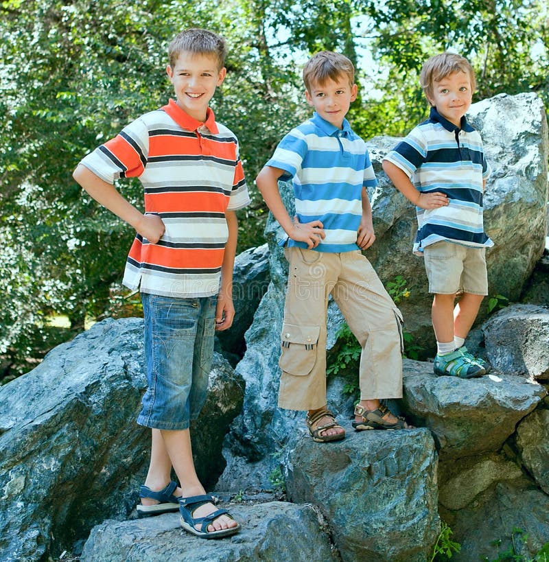 Three brothers in park stock photo. Image of green, carefree - 20484384