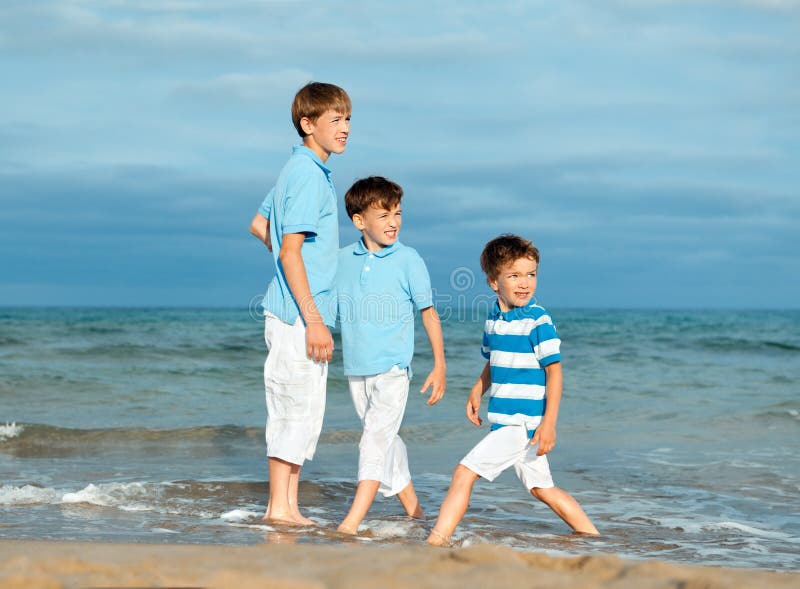 Three Brothers are Play on Beach Stock Image - Image of vacation, shore ...
