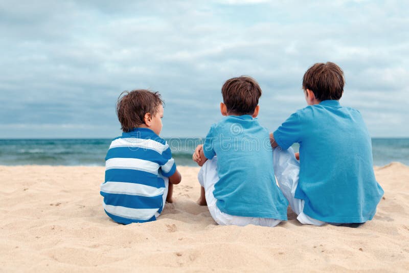 Three Brothers are Sitting on Beach Stock Image - Image of teen ...