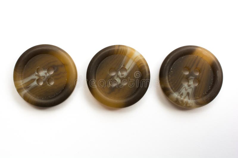 Three Brown Plastic Buttons Isolated on White Stock Image - Image of ...