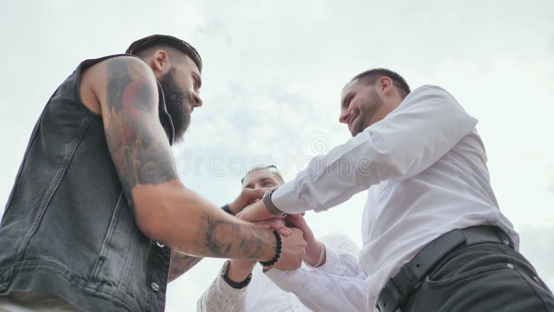 Three Brutal Men with a Beard Greet Each Other with a Handshake. Stock ...