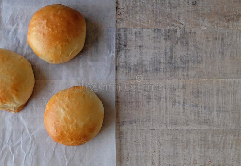 Three Burger Buns on Wood (Top View) Stock Photo - Image of buttercream ...