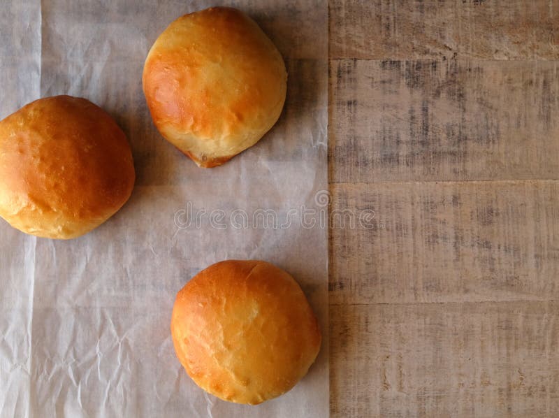 Three Burger Buns on Wood (Top View) Stock Photo - Image of buttercream ...