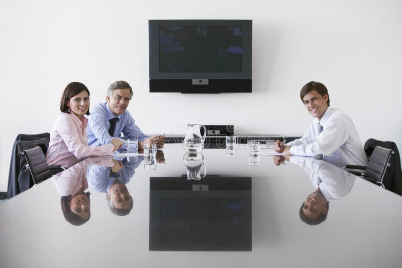 Businessman with Feet Up on Conference Table Stock Image - Image of ...