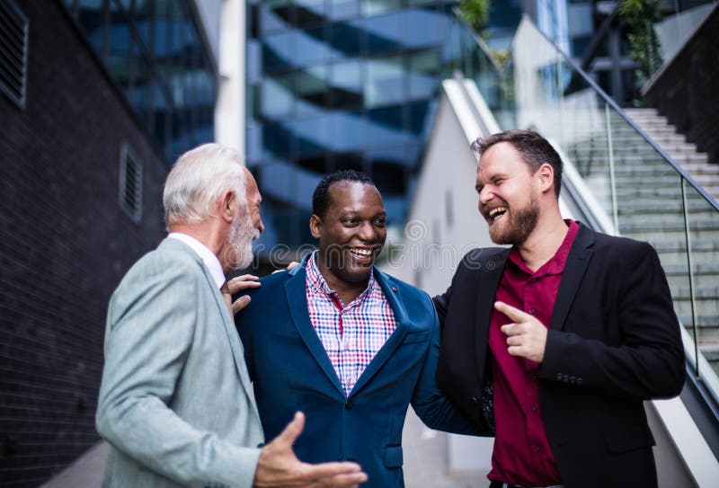 Three business men talking stock image. Image of american - 218039681