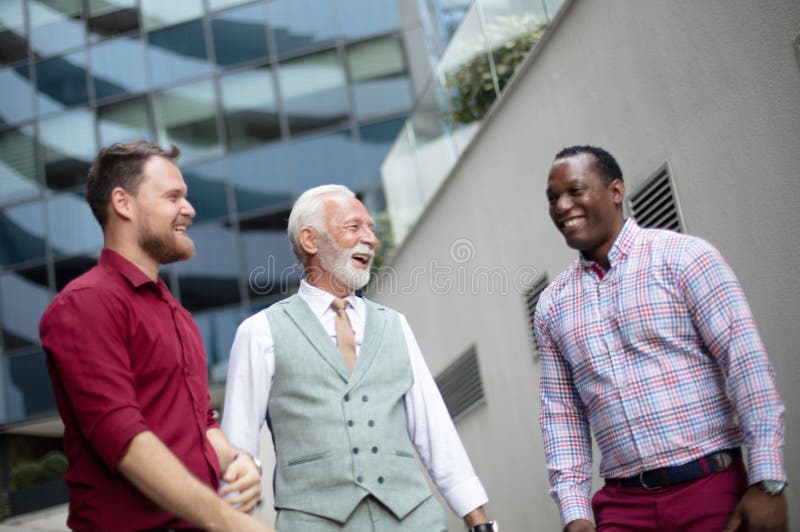 Three business men talking stock photo. Image of ethnicity - 219523734