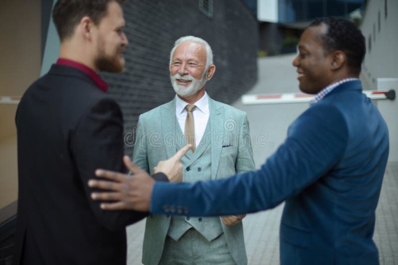 Three Business Men Talking. Focus is on Senior Man Stock Image - Image ...