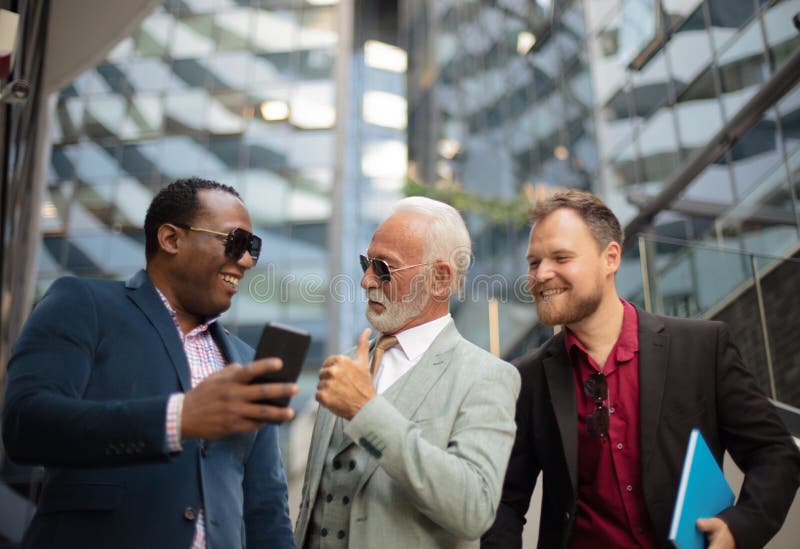 Business Men Walking and Talking Outside. Man Holding Mobile Stock ...