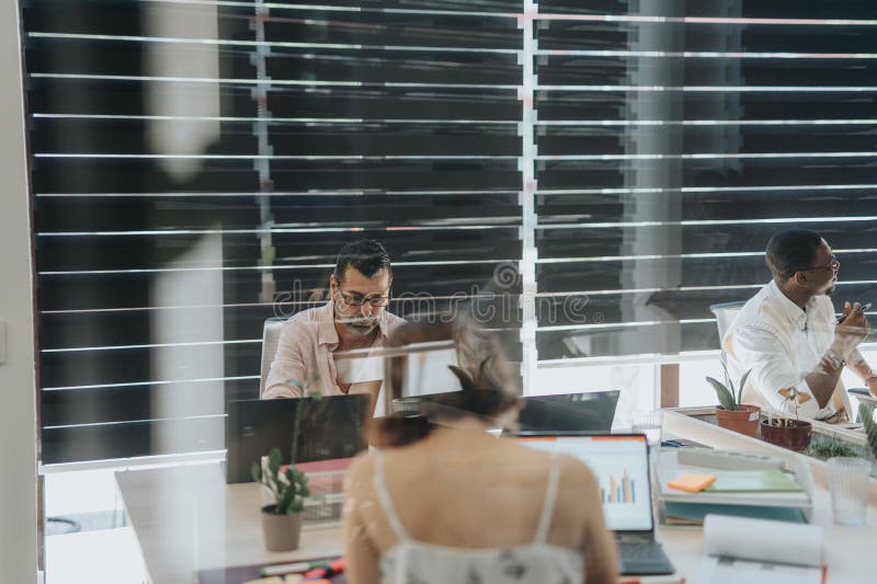 Three Business People Analyzing Data during Work Time Stock Image ...