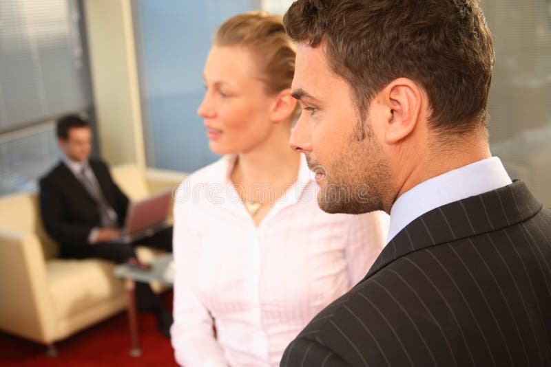 Three Business People in Office Environment Stock Image - Image of ...