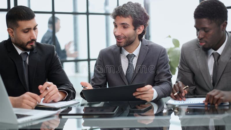 Three Colleagues of Modern Work Co-working Space Talking and Smiling ...