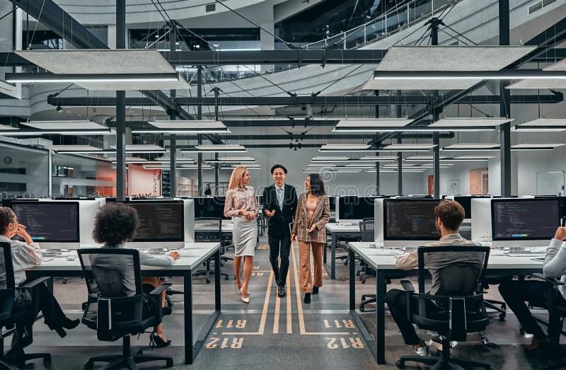 Three Business People Walk Around a Spacious Large Office with a Lot of ...