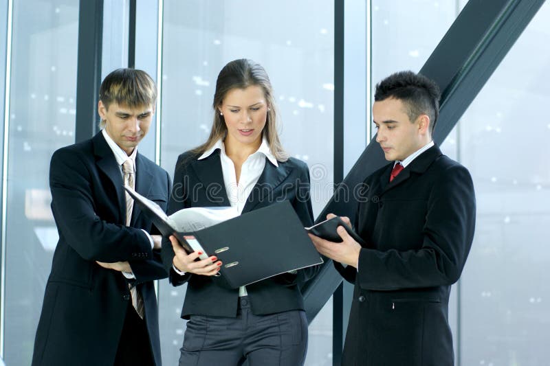 Three Business People are Working in an Office Stock Image - Image of ...